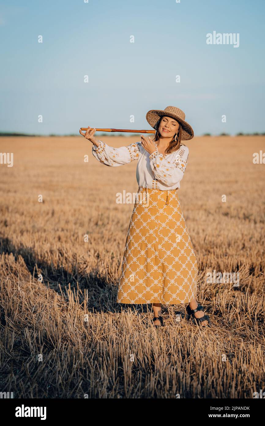 Wooden flute player hi-res stock photography and images - Alamy