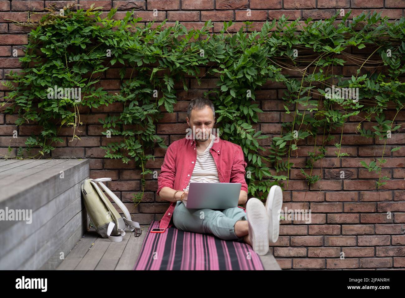 Focused young businessman freelancer engaged in distant work from ...