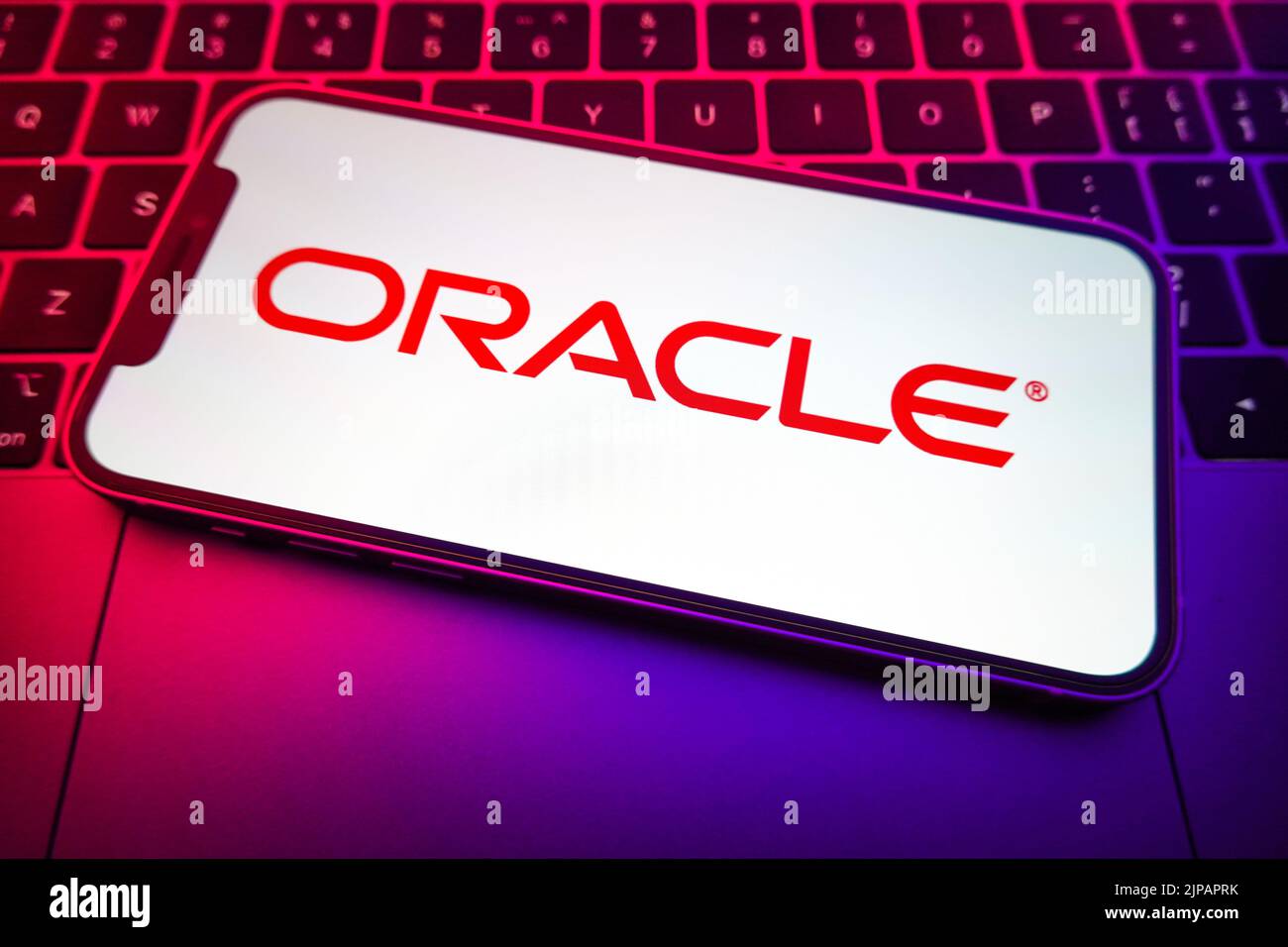 In this photo illustration, the Oracle logo is displayed on the screen ...