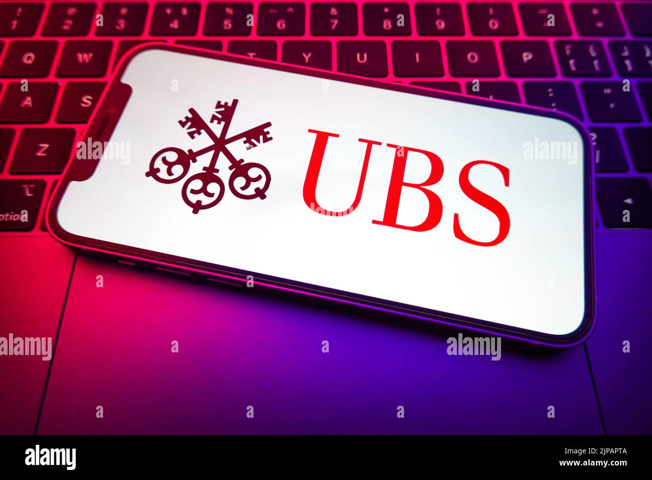 In this photo illustration, the UBS logo is displayed on a smartphone ...