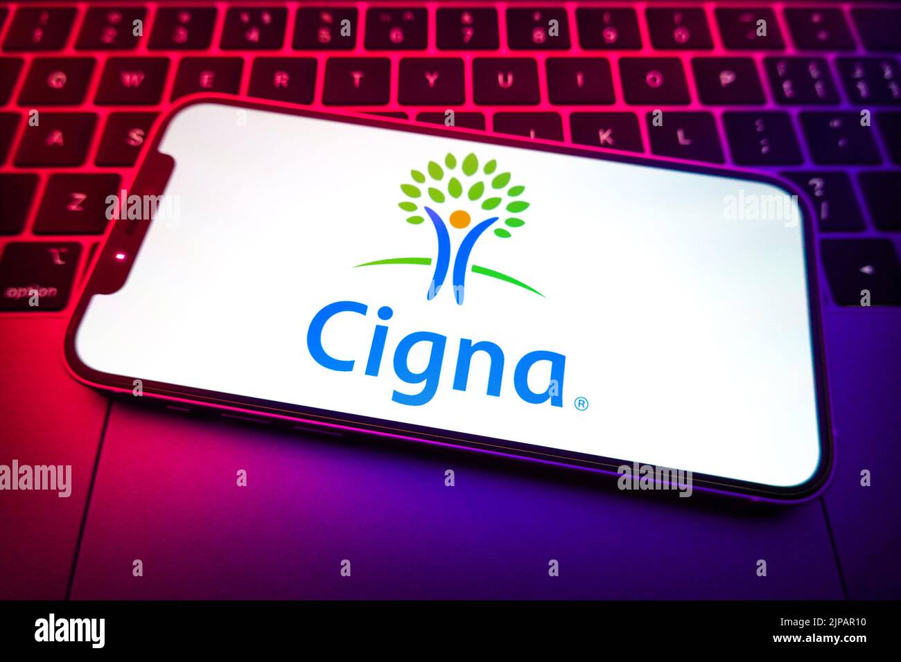 In this photo illustration, the Cigna logo is displayed on a smartphone ...