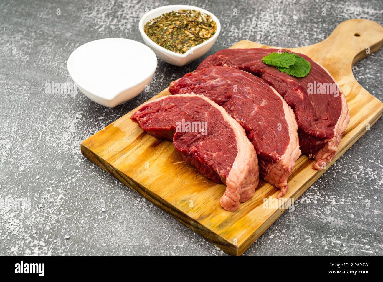 raw picanha steaks with seasonings Stock Photo - Alamy