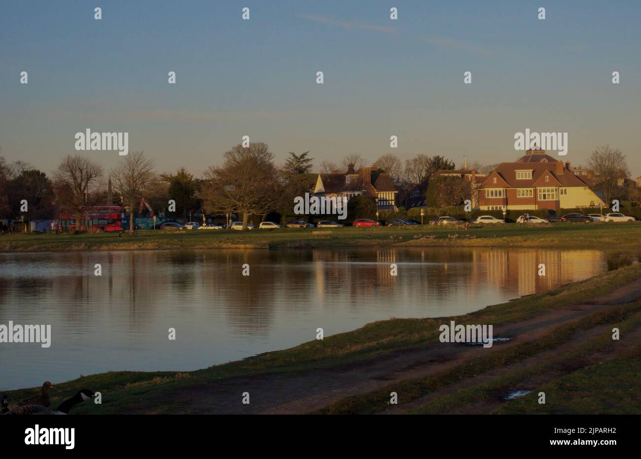 Rushmere Pond, Wimbledon Common, pictured at dusk in February 2022 ...