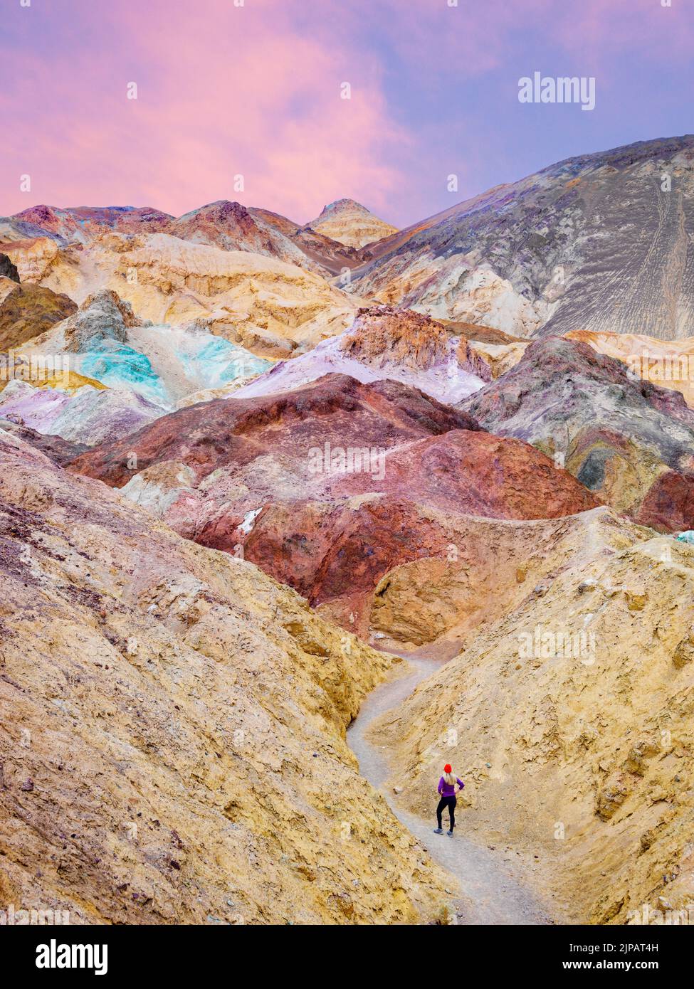 Hiker at Artists colorful Palette, Bad Lands Artists Drive Death Valley ...