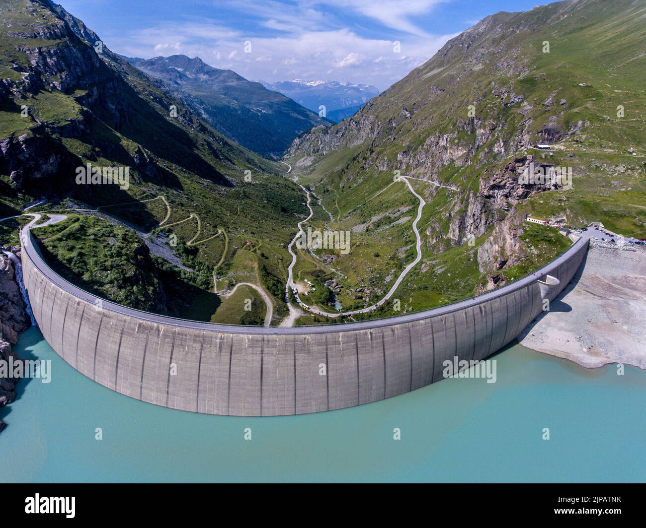An aerial scenery of the Dam of the Moiry reservoir below the Moiry ...