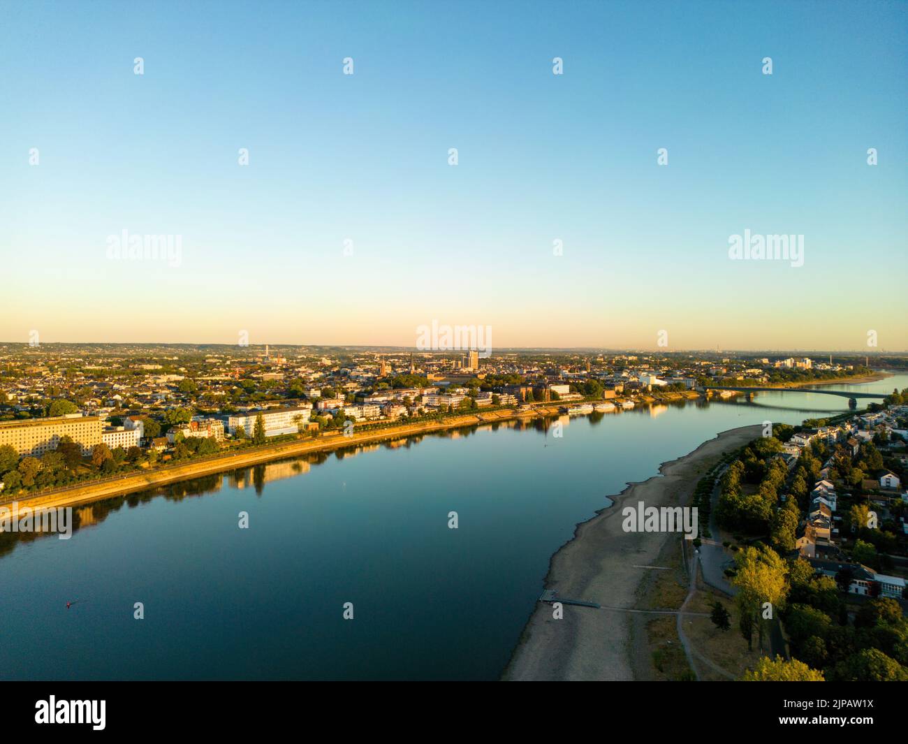 An aerial view of the Rhine river with its surrounding lush trees and ...