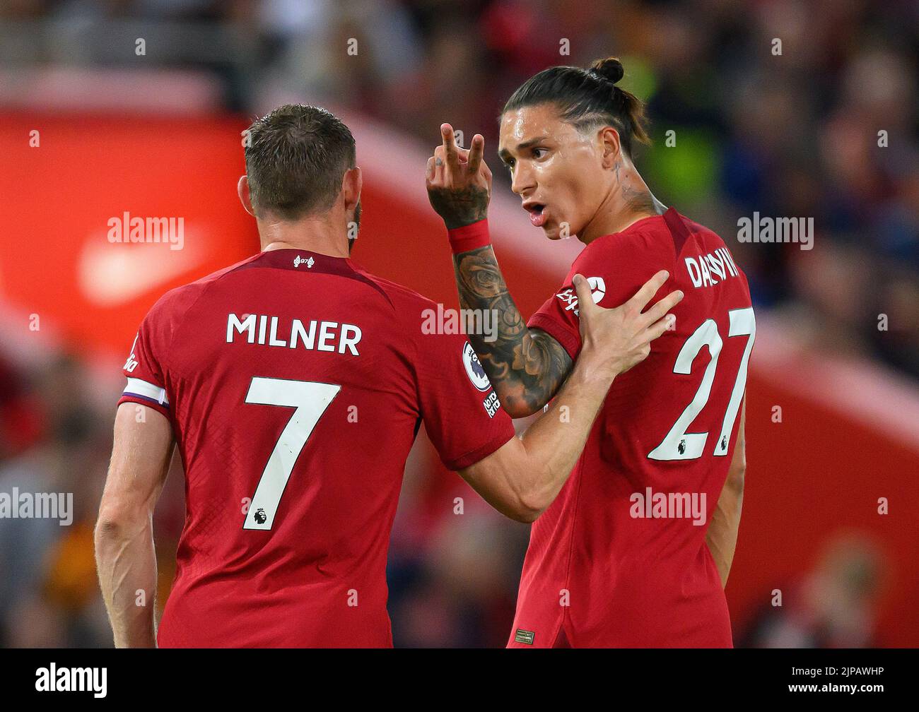 Liverpool's Darwin Nunez is held away from Referee Paul Tierney after ...
