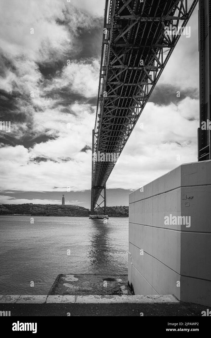 Red steel truss structural details of 25 de Abril suspension bridge in ...