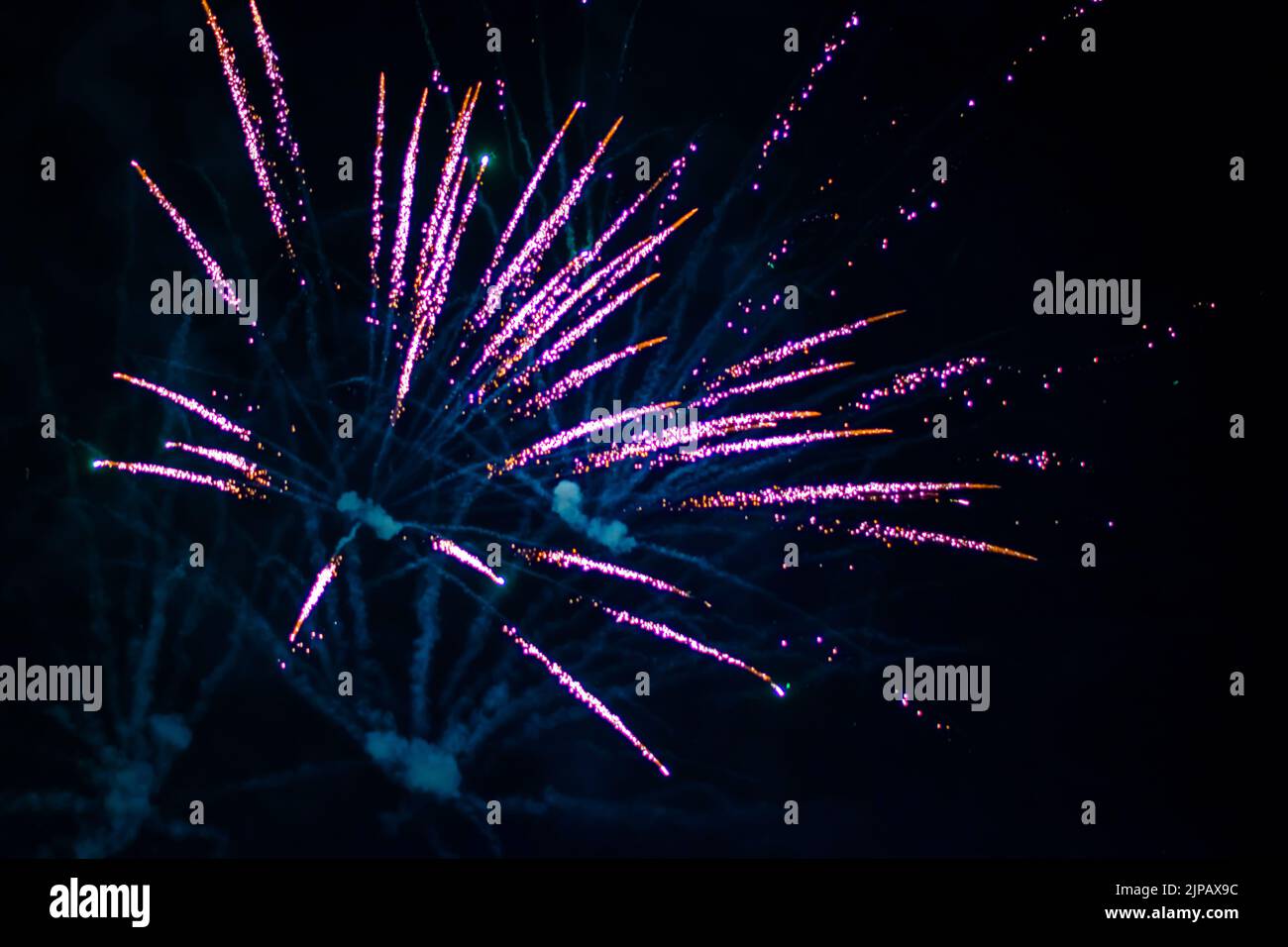 An explosion of bright single fireworks, against the background of the ...