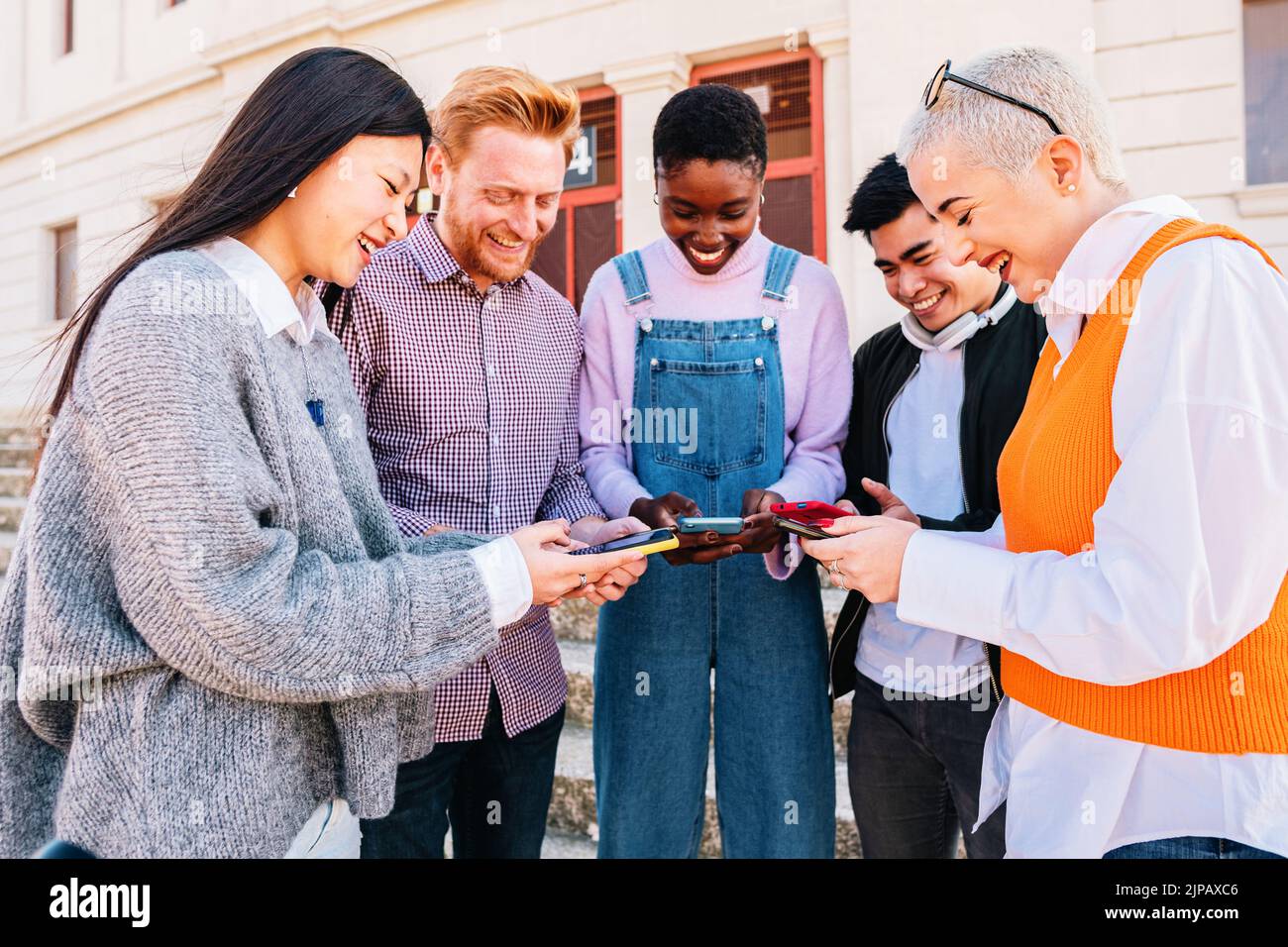 Group of friends having fun with smartphones browsing in social media ...