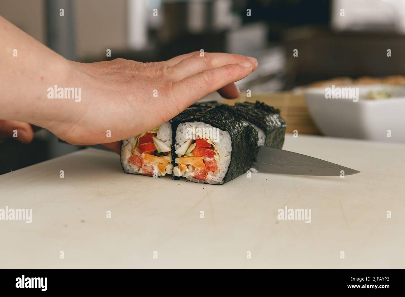 Close up of man japanese restaurant chef cooking sushi in the kitchen ...