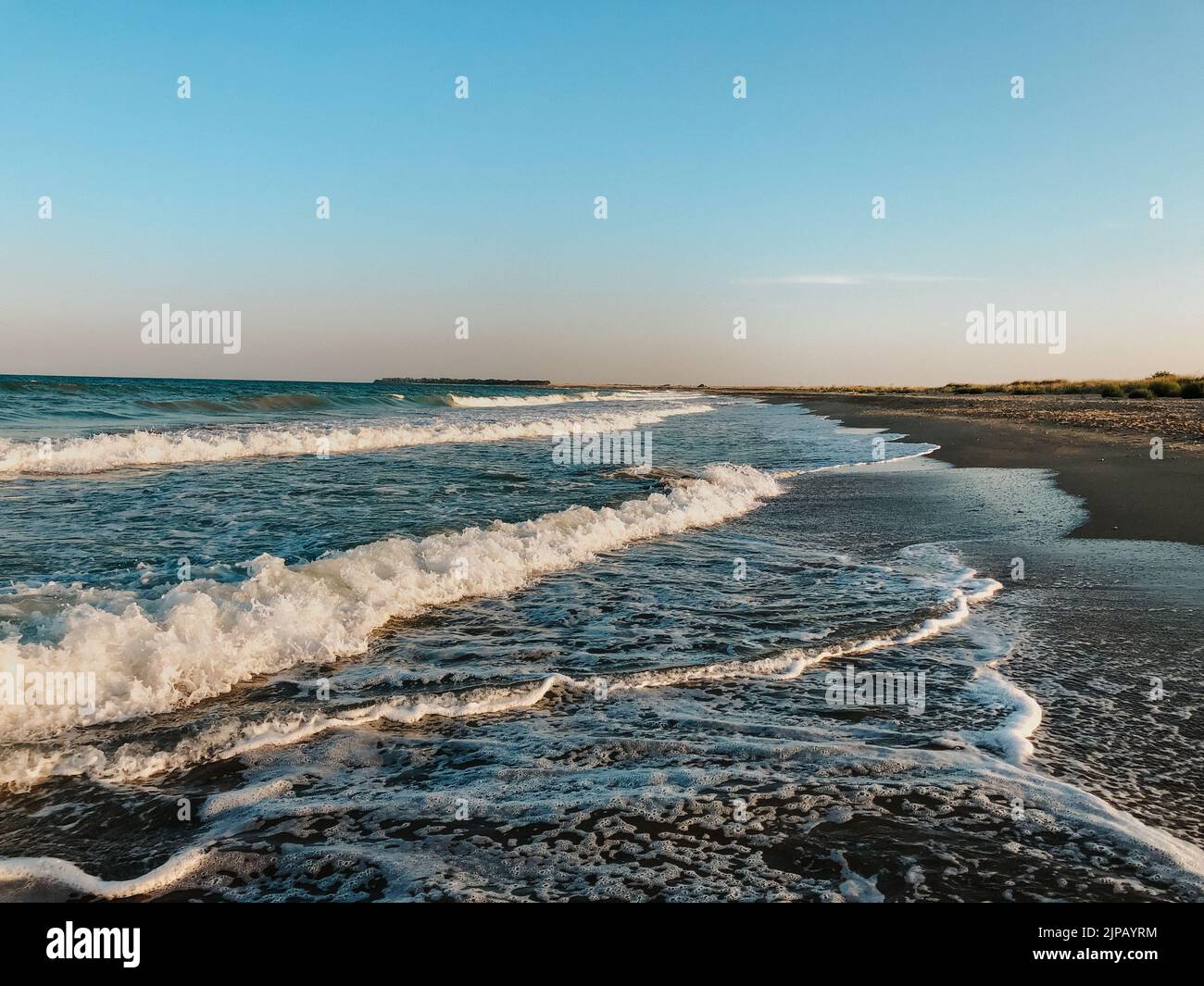Sea blue aquamarine waves line sunny sand beach. Soft wave of ocean ...