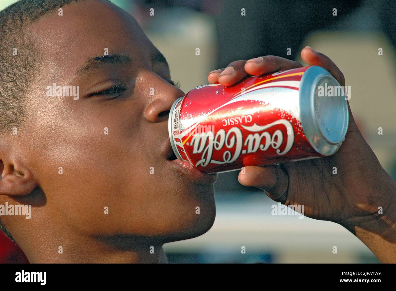 Black youth drinking coke at Preacher Rick Gage of his Atlanta Ministry ...