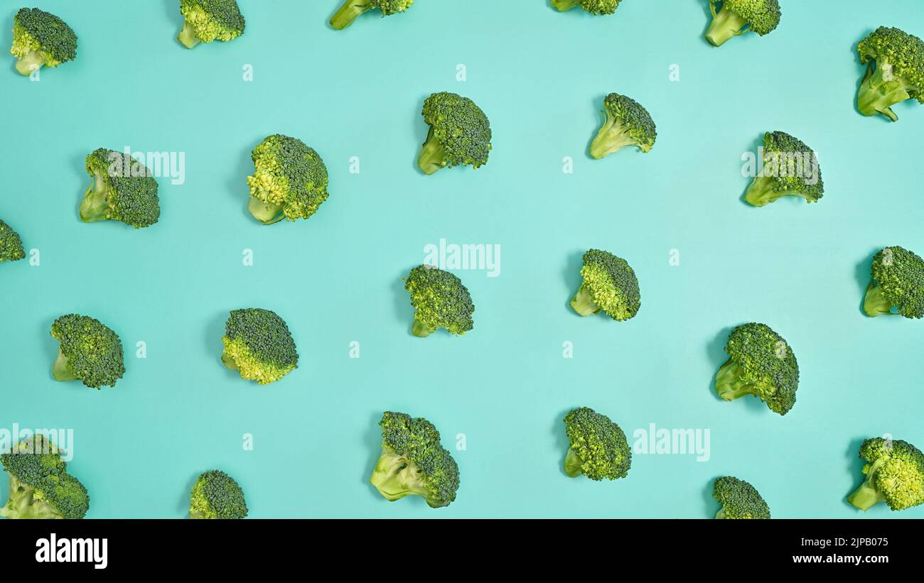 Broccoli creative pattern on pastel cyan background. Healthy food ...
