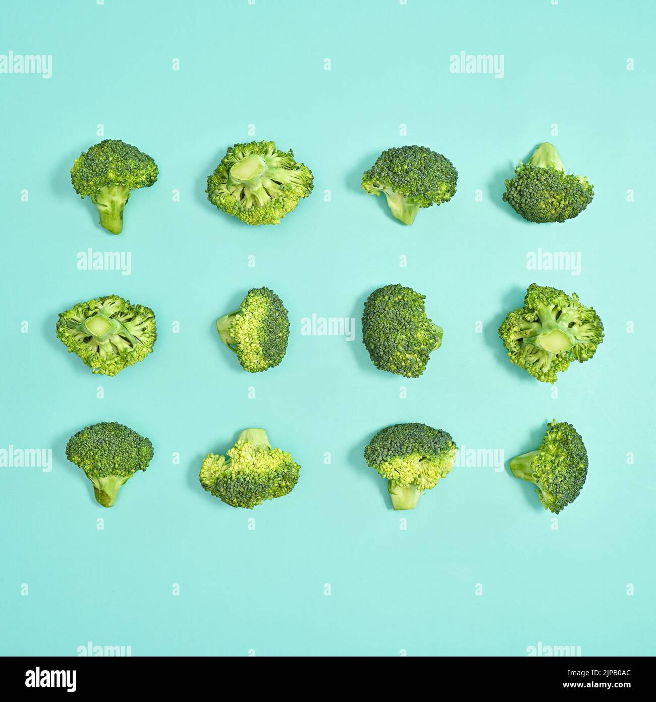Broccoli creative layout on pastel cyan background. Healthy food ...