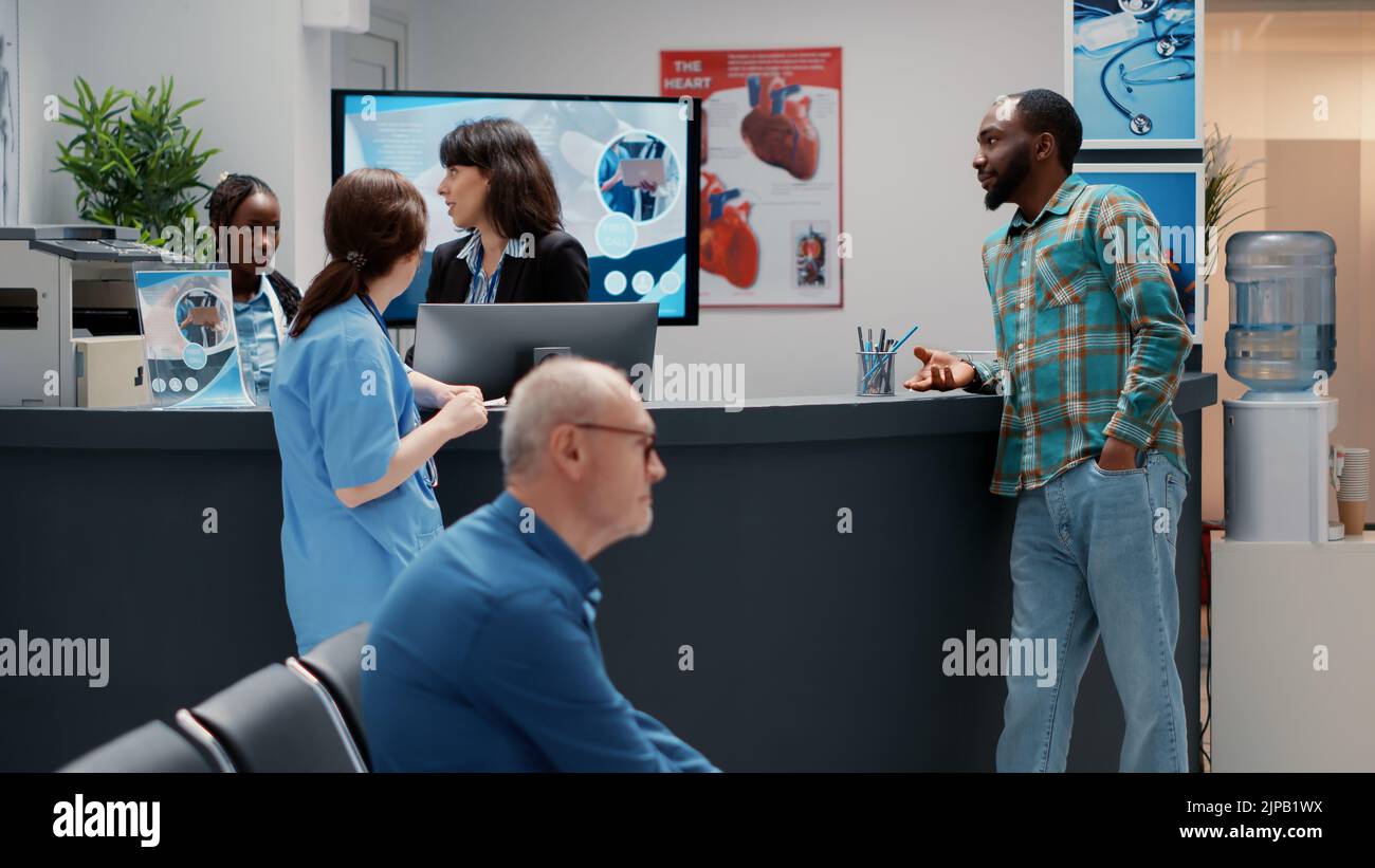 Multiethnic people chatting about medical system support, african ...