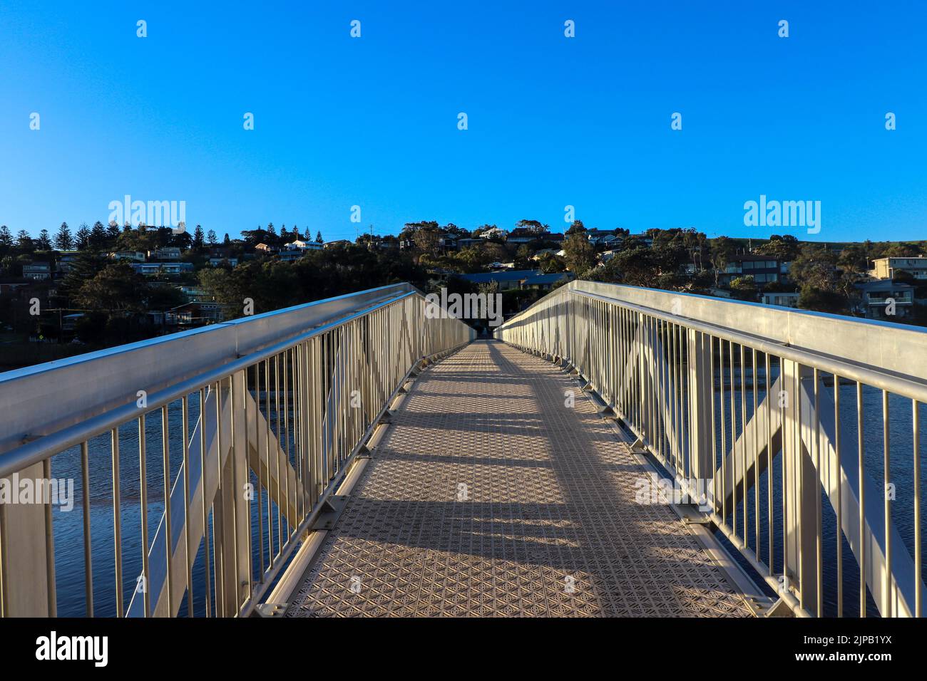 A modern pedestrian bridge over Crooked river at Gerroa South Coast NSW ...