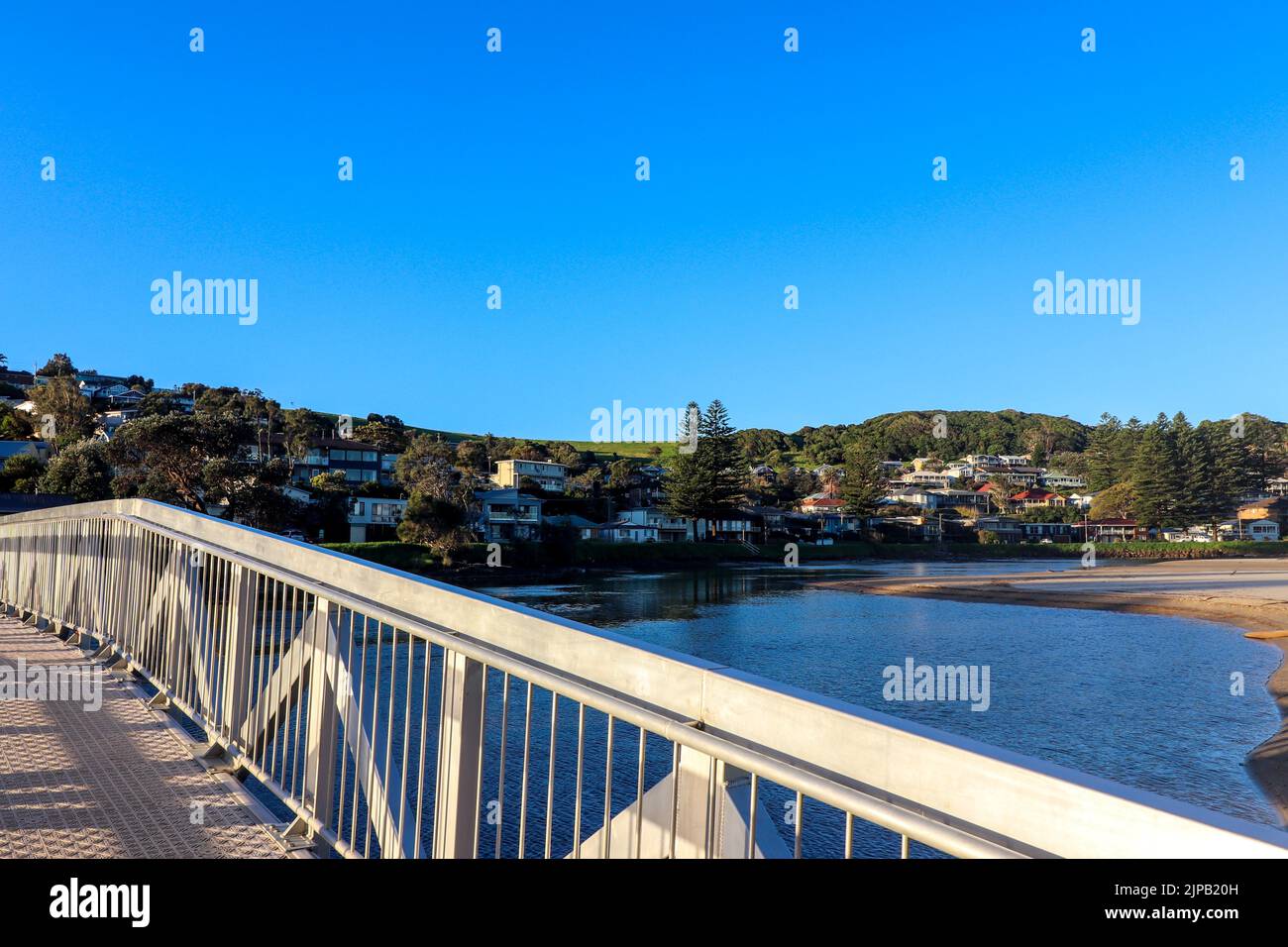 A modern pedestrian bridge over Crooked river at Gerroa South Coast NSW ...