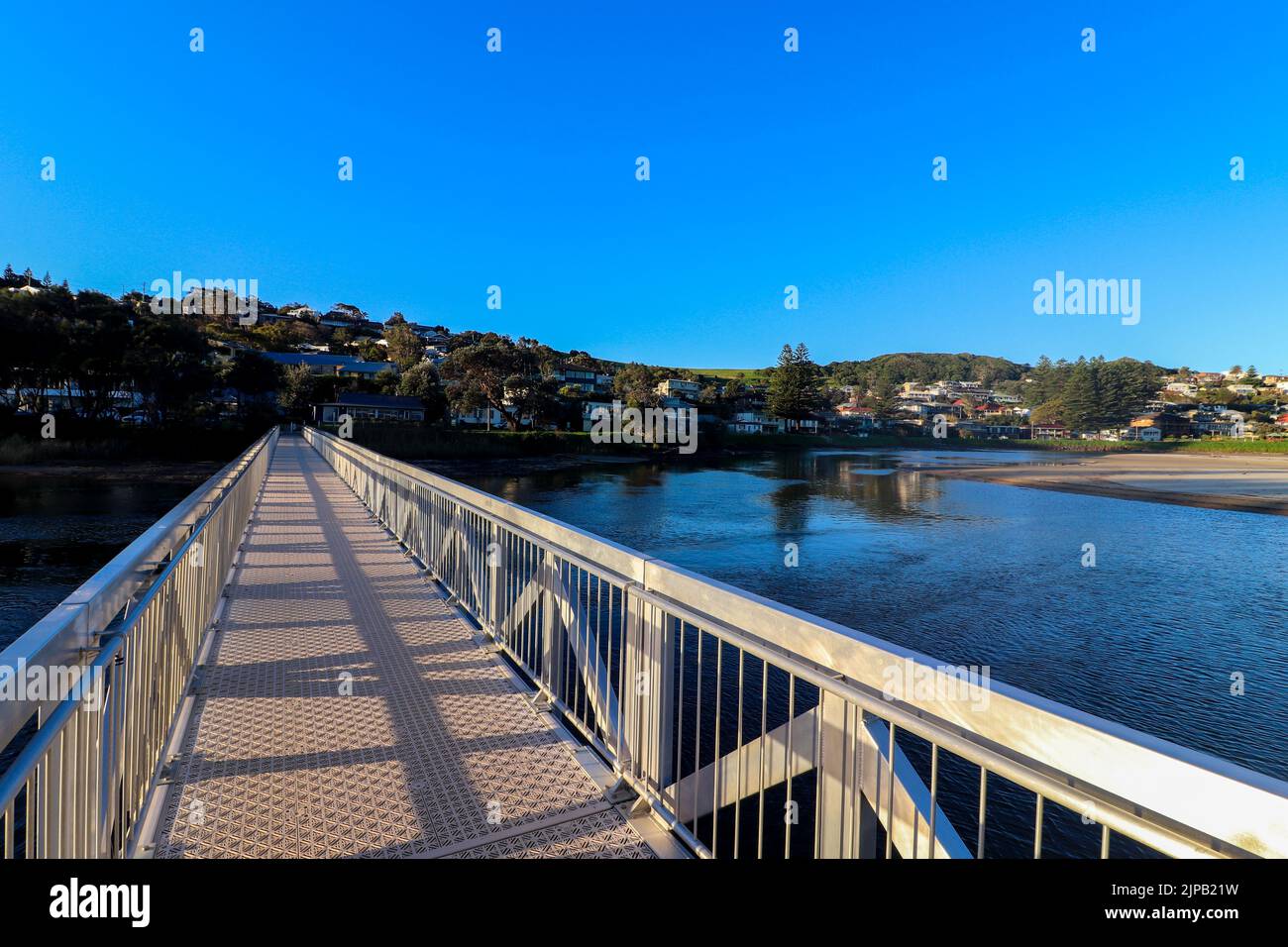A modern pedestrian bridge over Crooked river at Gerroa South Coast NSW ...