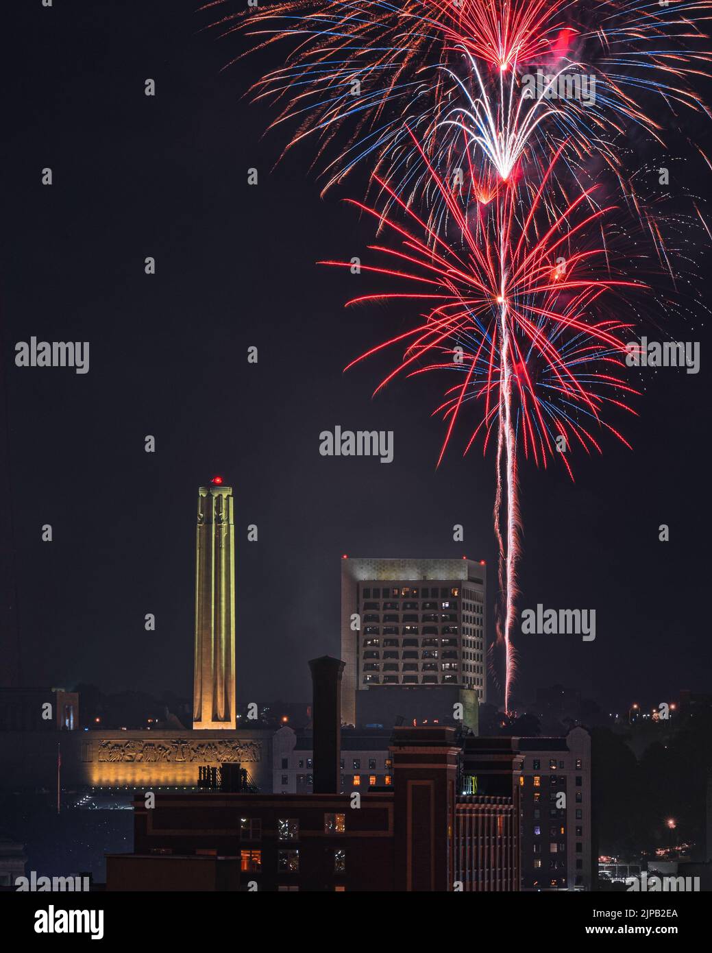 A vertical shot of a show of exploding fireworks over Liberty Memorial ...