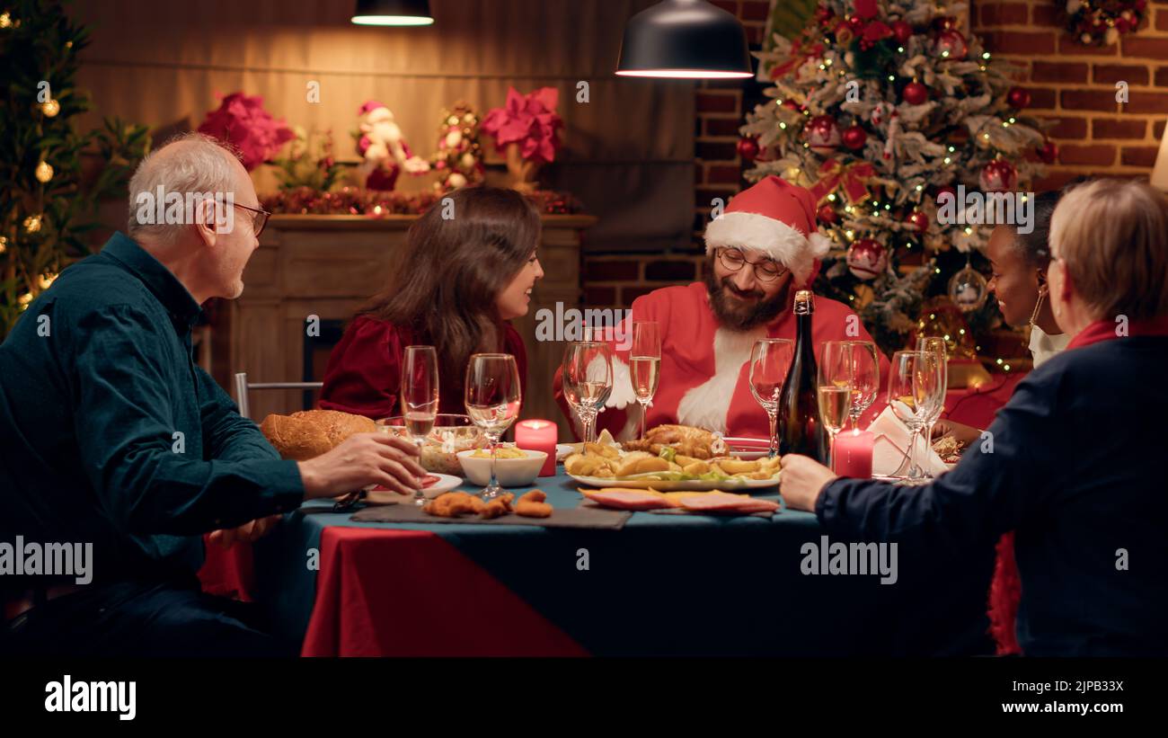 Funny young adult person disguised as Santa Claus discussing with ...
