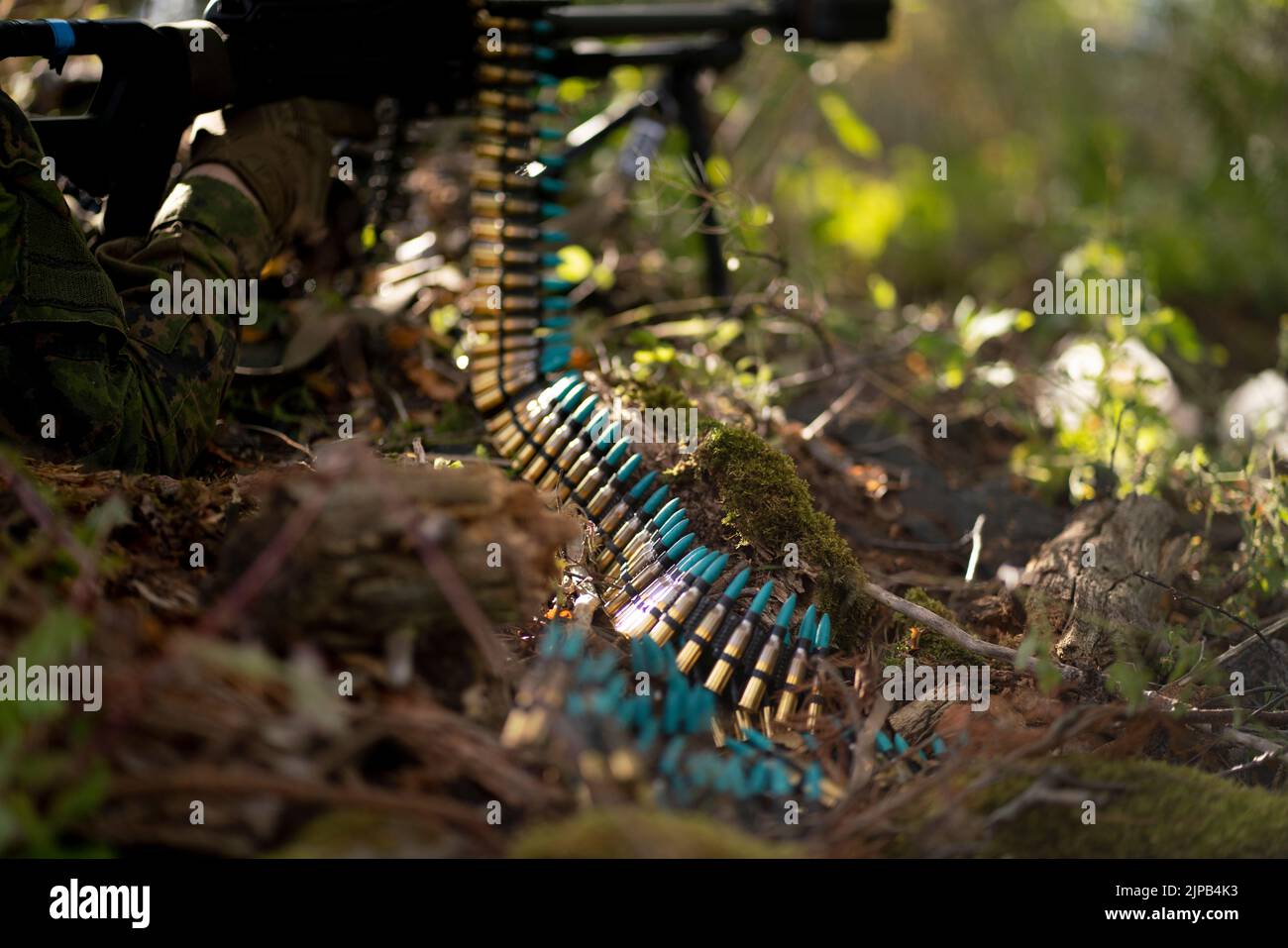 A Finnish soldier fires a KK 62 PKM machine gun during an island ...