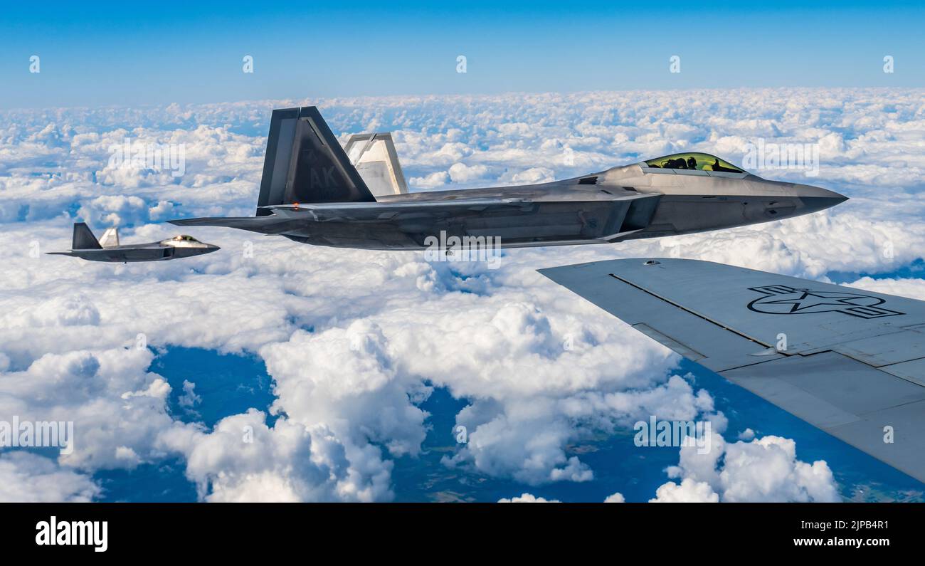 Two U.S. Air Force F-22 Raptor aircraft assigned to the 90th Fighter ...