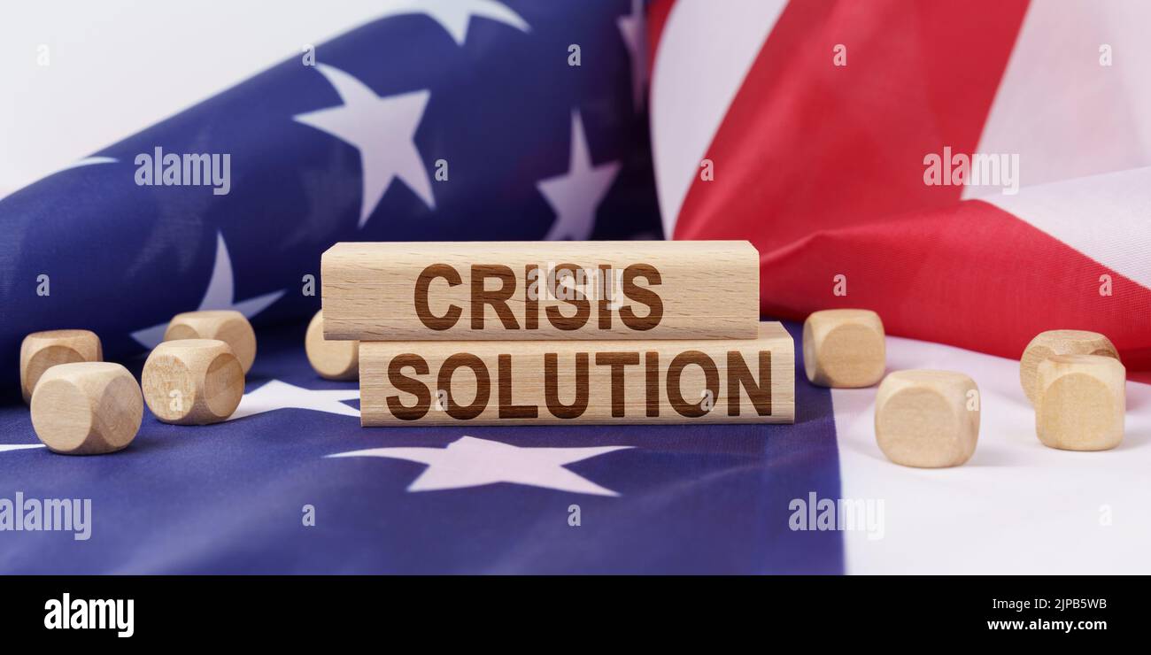 Business concept. The American flag has wooden cubes and plaques that ...