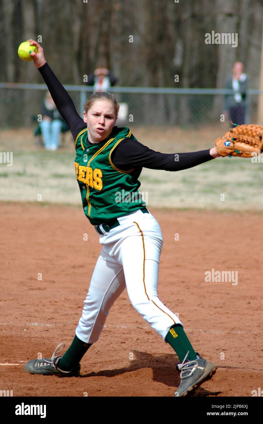 Youth girls team and coaches on sports fields during spring sports ...