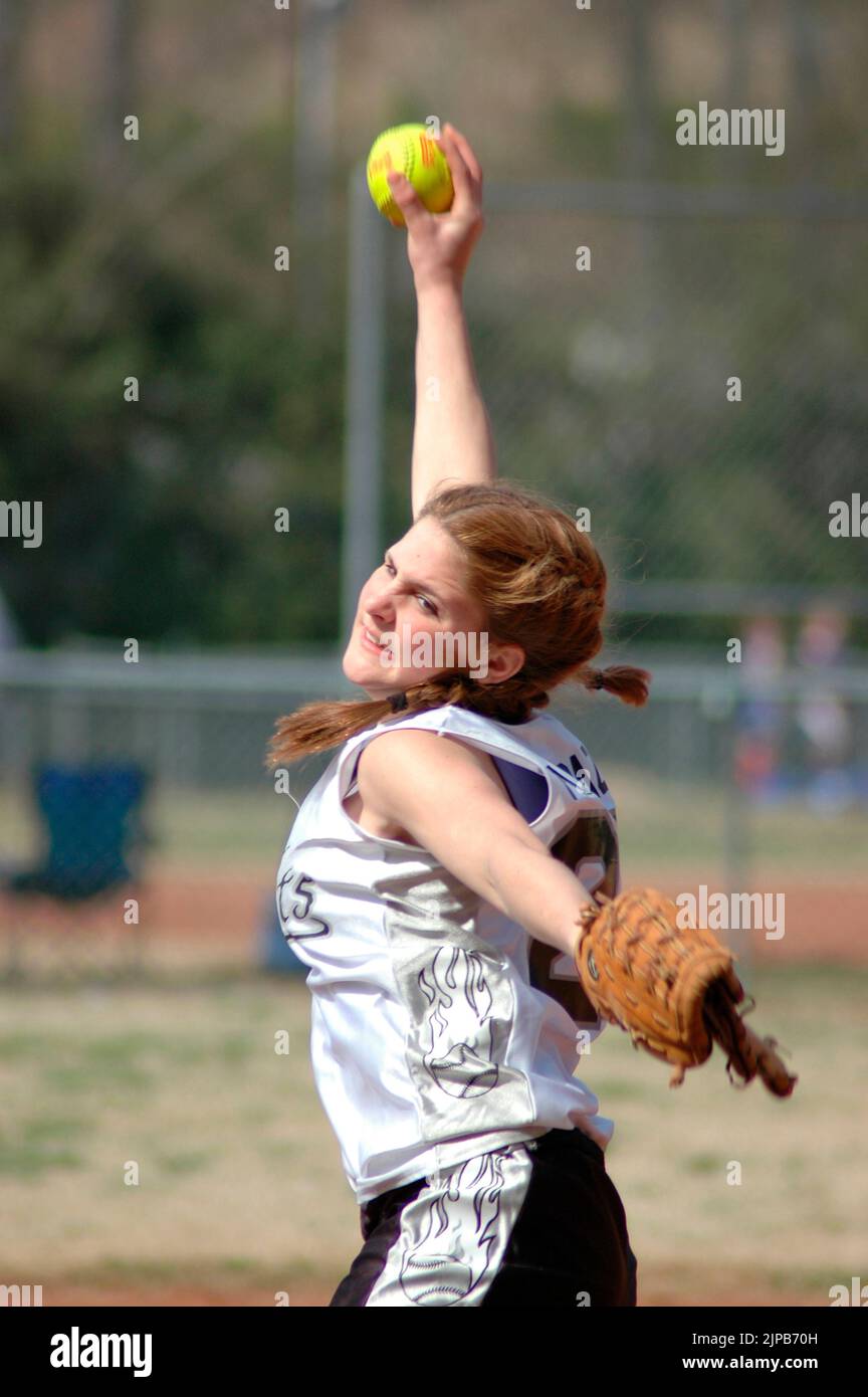 Youth girls team and coaches on sports fields during spring sports ...