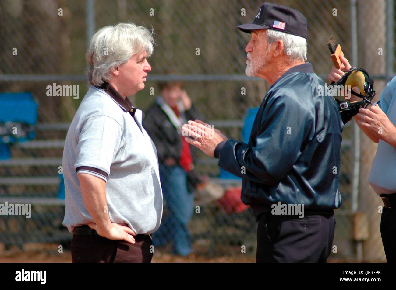 Youth and coaches on sports fields during spring sports, being coached ...