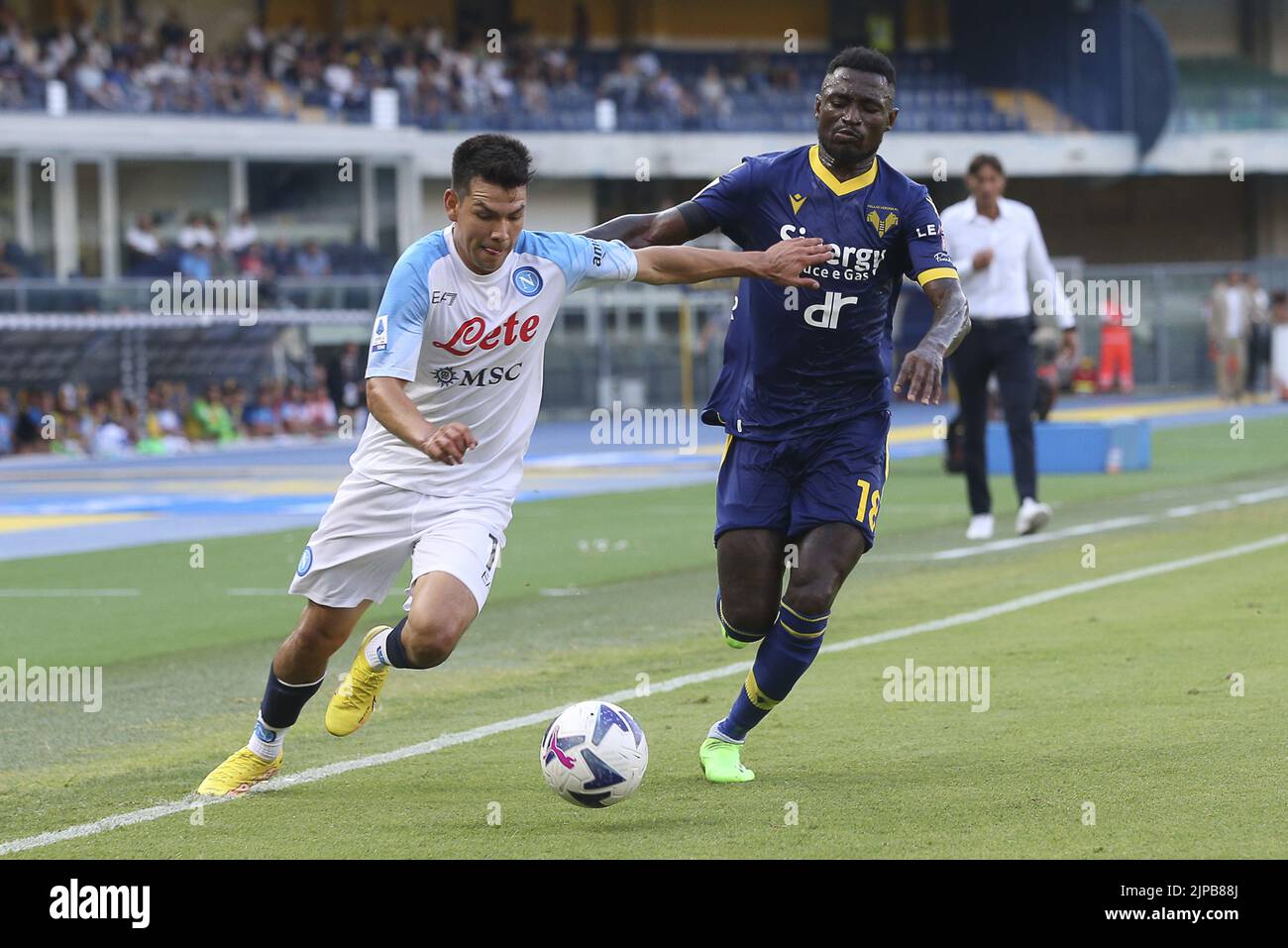 Hirving :Lozano of SSC Napoli competes for the ball with Martin Hongla ...