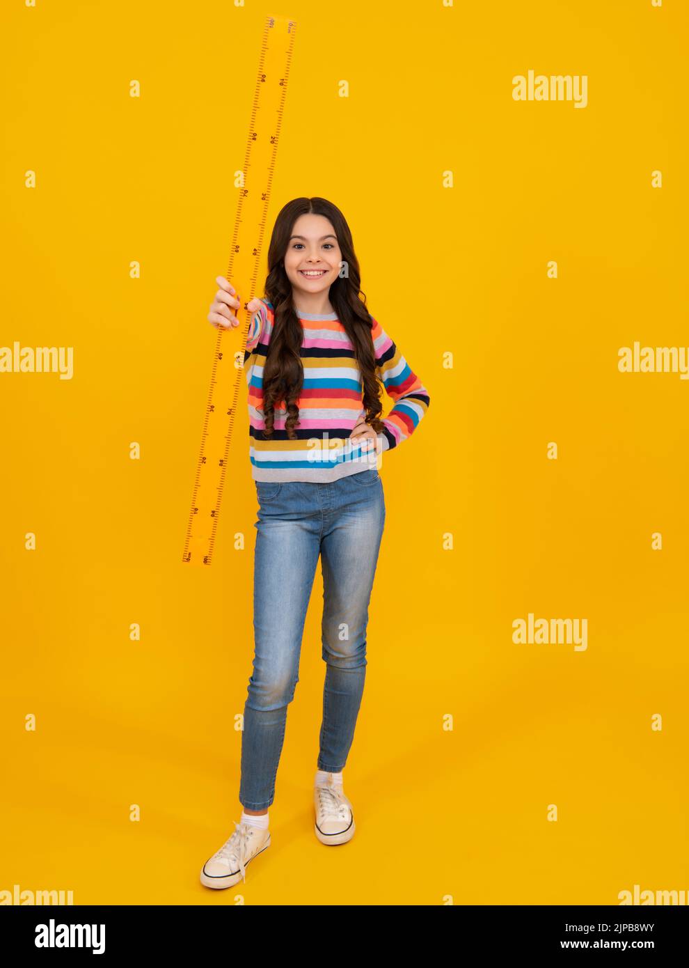 Teenager school girl study math or geometry lesson, measure the size ...