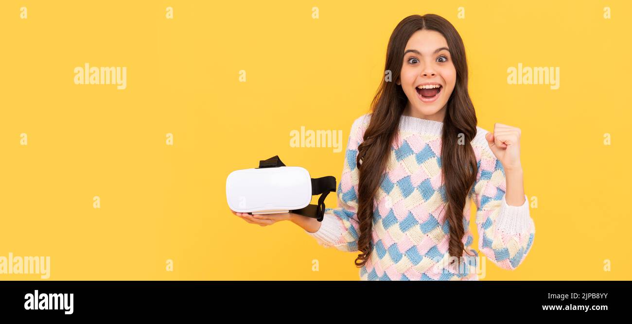 childhood development. amazed teen girl hold wireless VR glasses ...