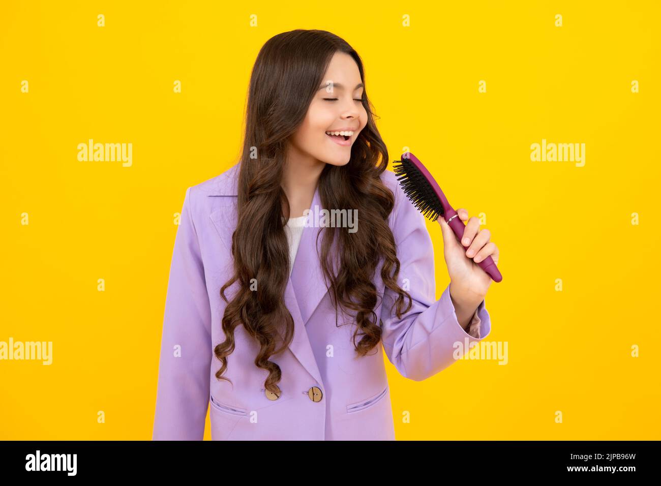 Teenager girl with long hair holding comb hairbrush for combing, beauty ...