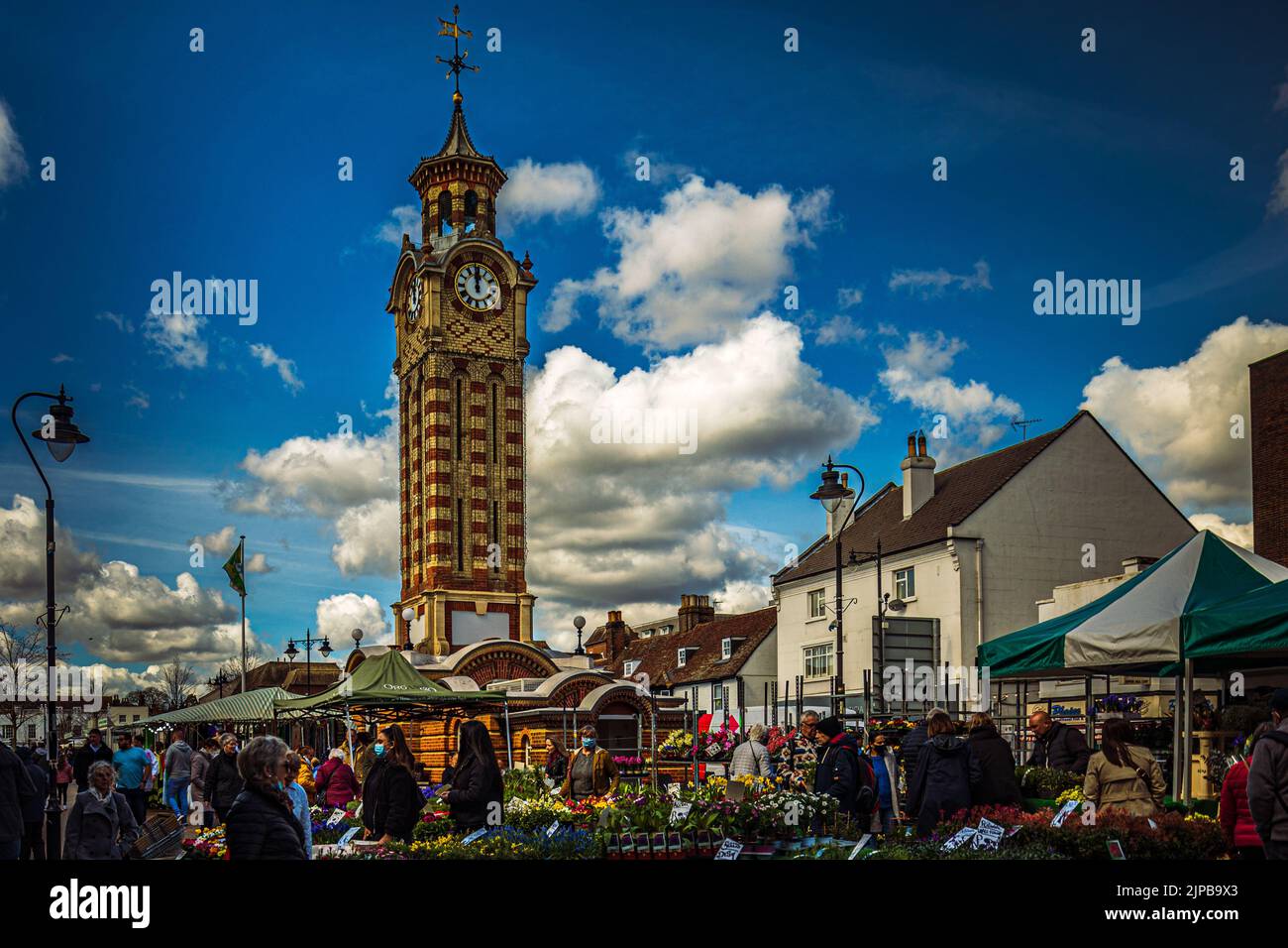 An outdoor market with a lot of people in front of Epsom High Street ...