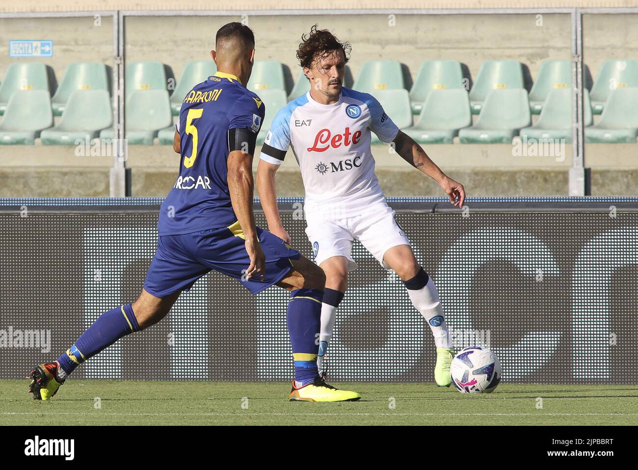 Mario Rui of SSC Napoli competes for the ball with Marco Davide Faraoni ...