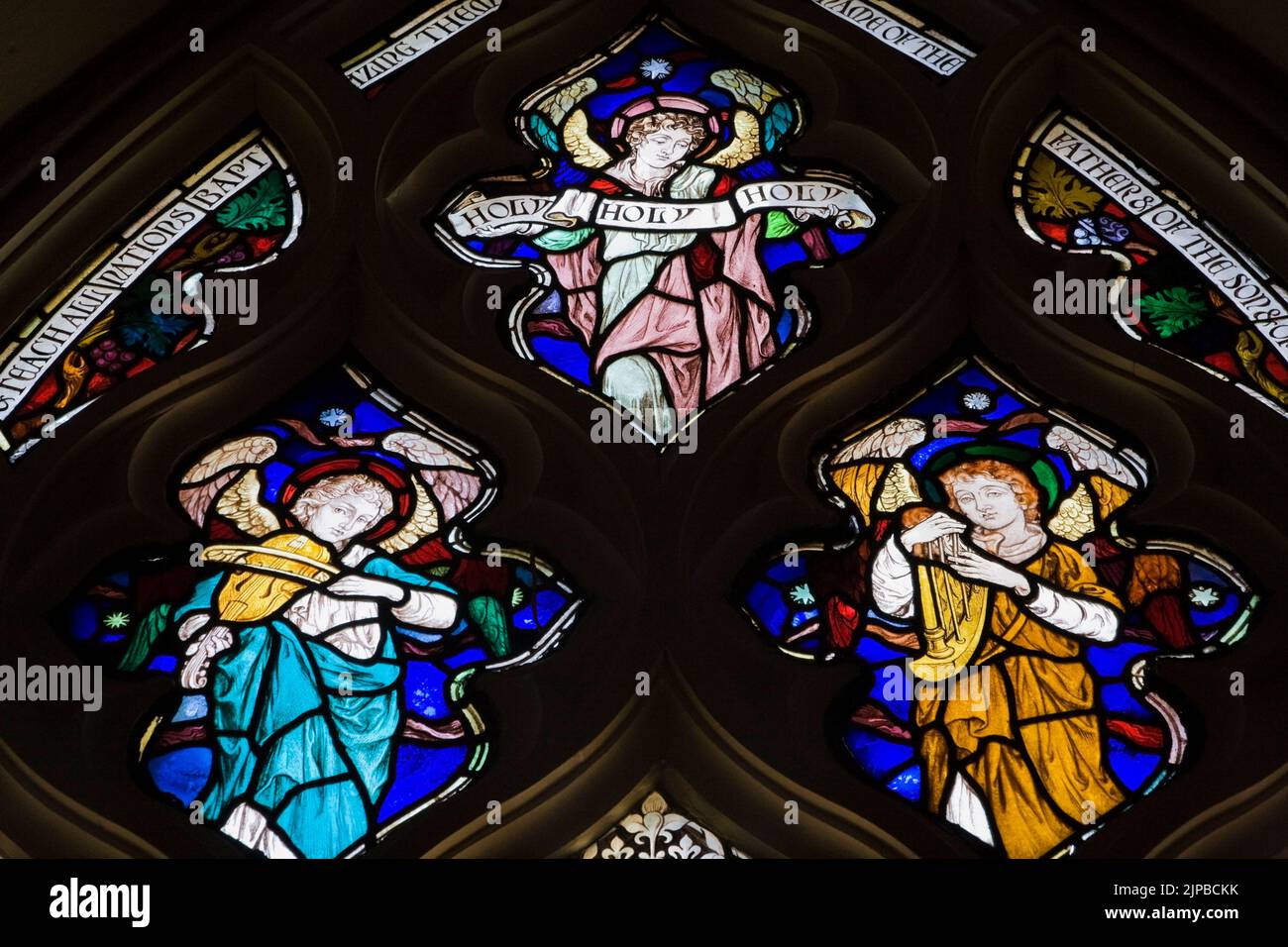 Colourful stained glass window with religious scenes, Saint-George's ...