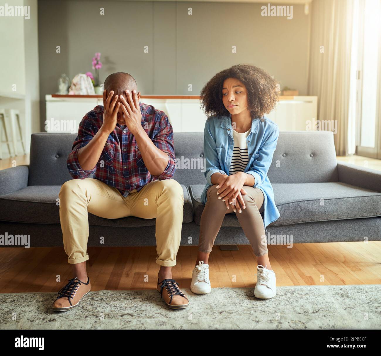 The stress is seeping in today. a stressed out young couple seated on a ...