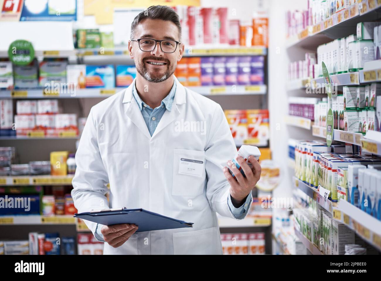 Its new on the market. Portrait of a mature pharmacist doing inventory ...
