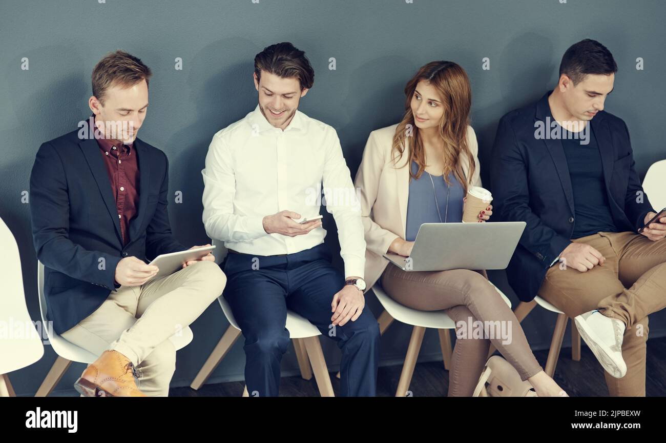 Getting to know our potential colleagues. a group of businesspeople ...