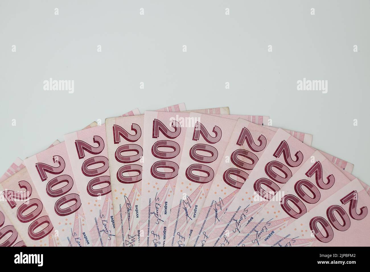 Turkish Lira banknotes of various color, pattern and value on white ...