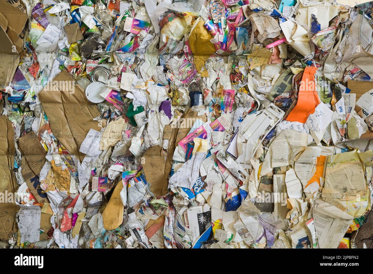 Tied bale of recyclable cardboard and paper at a sorting centre Stock ...