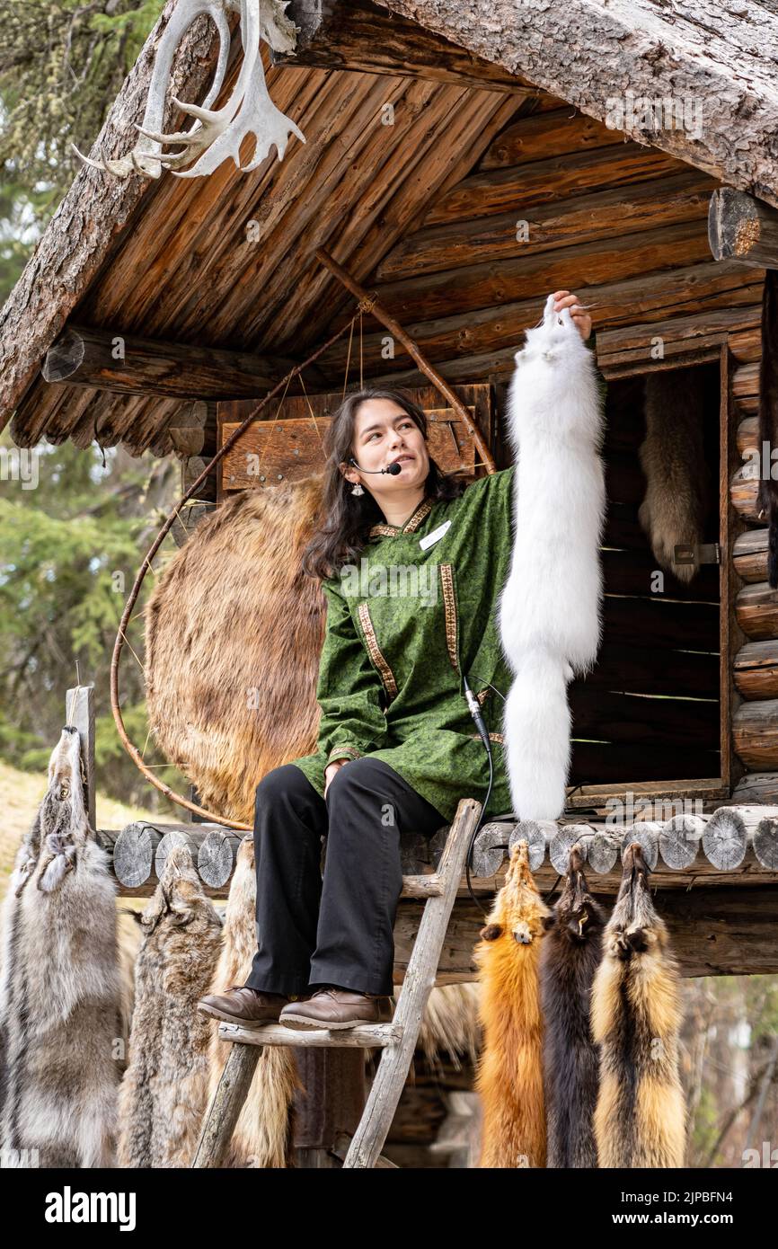 An Athabaskan Girl poses in native costume at the Chena Indian Village ...