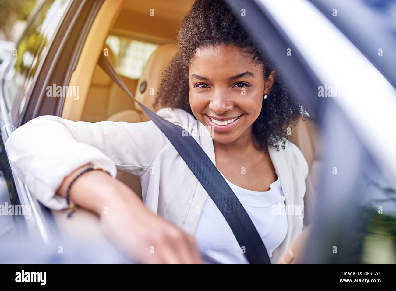 Need a ride. Cropped portrait of an attractive young businesswoman ...