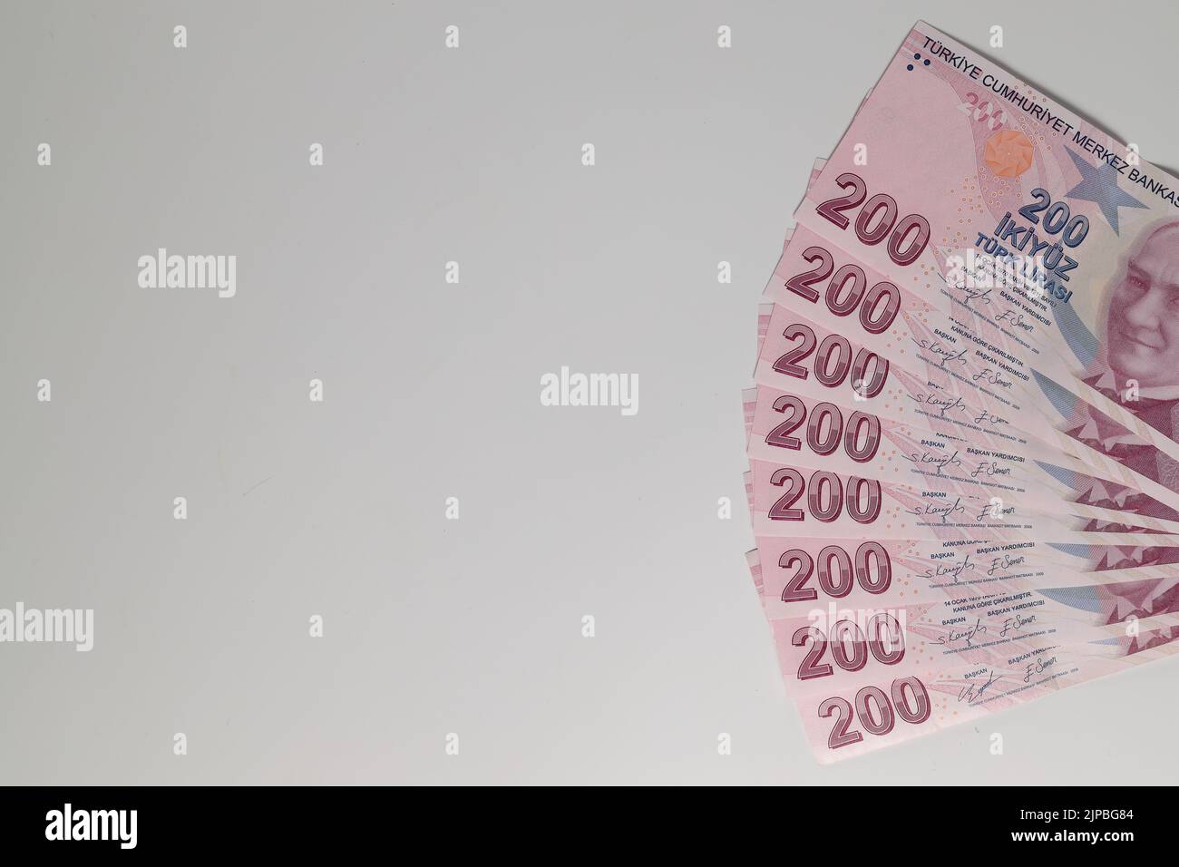 Turkish Lira banknotes of various color, pattern and value on white ...