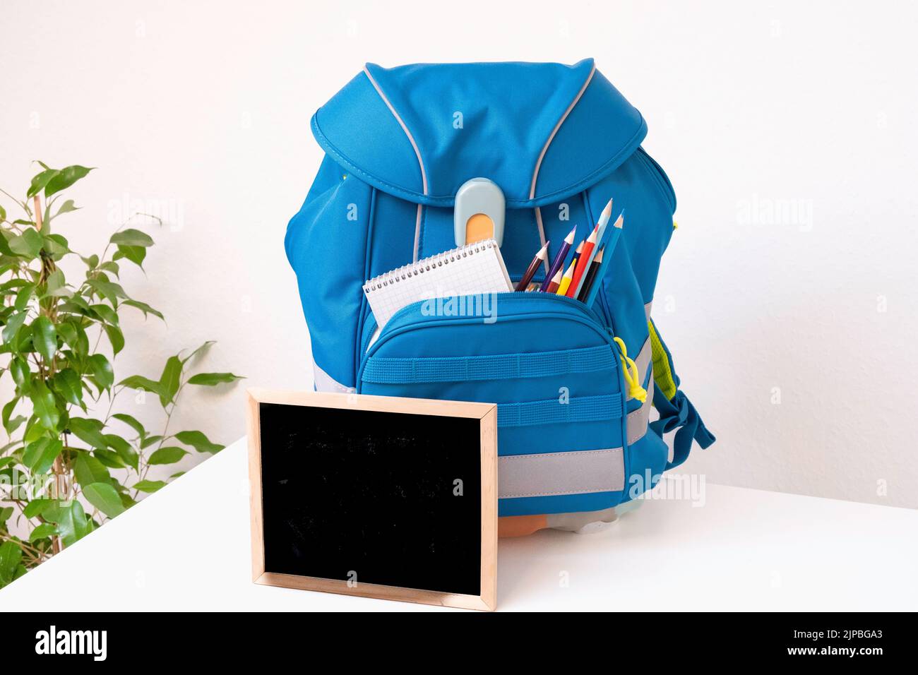 School backpack on the table. Preparation for school Stock Photo - Alamy