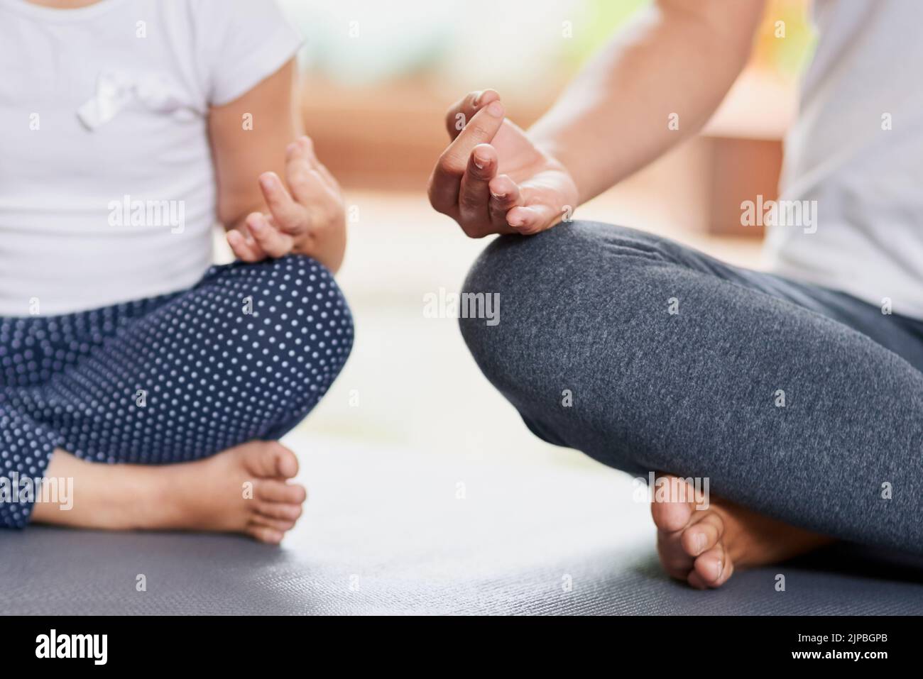 Keep your focus. an unrecognizable woman and little girl doing a yoga ...