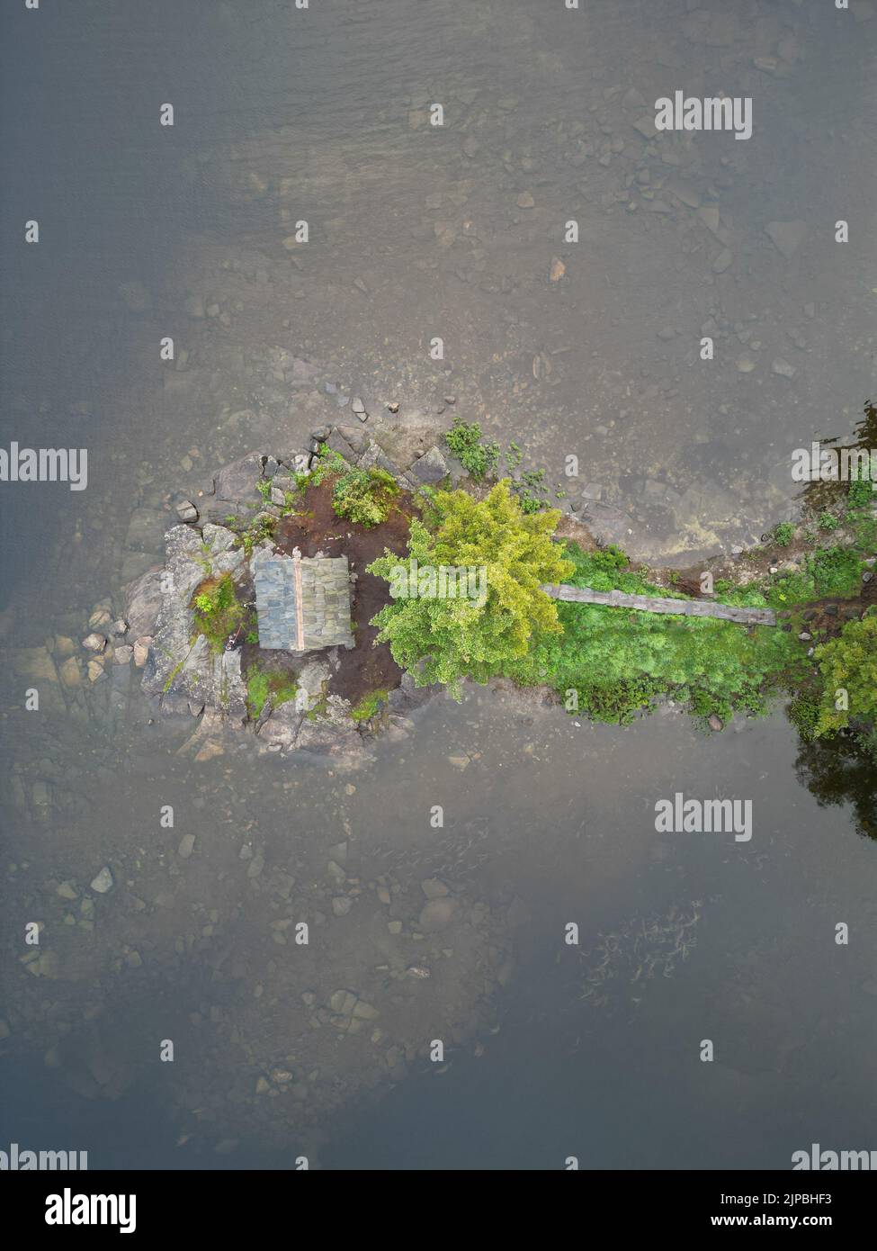 An aerial view of a hut in an islet Stock Photo - Alamy