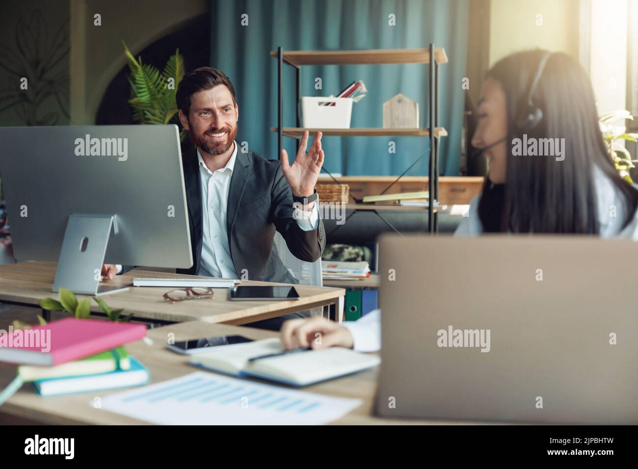 Worker waving hi-res stock photography and images - Alamy